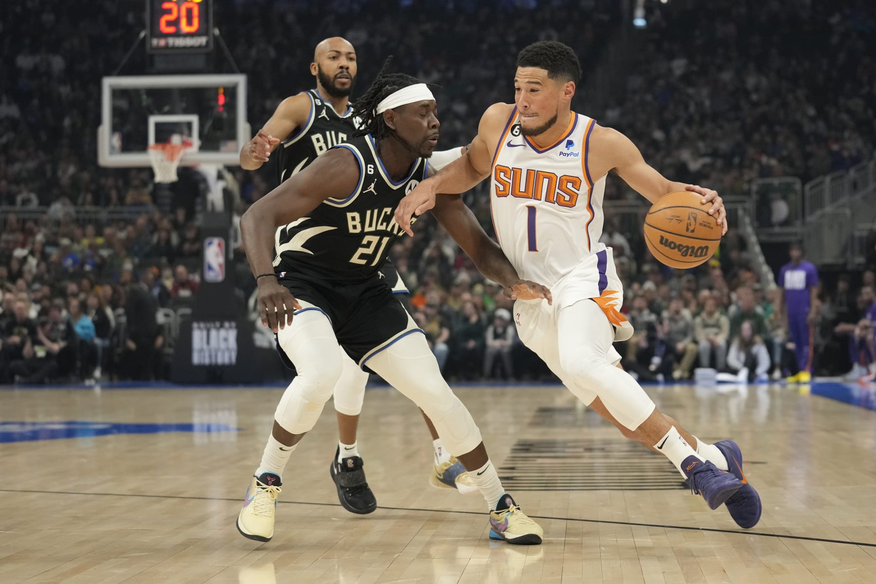 Report: Suns' Devin Booker, Celtics' Jrue Holiday Join LeBron, Curry as ...